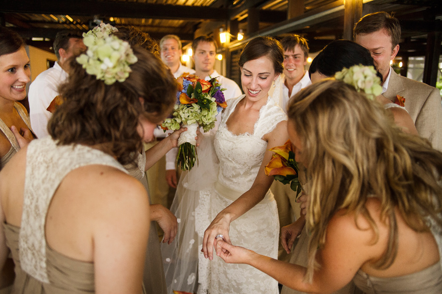 The bride surrounded by her wedding party moments after the ceremony